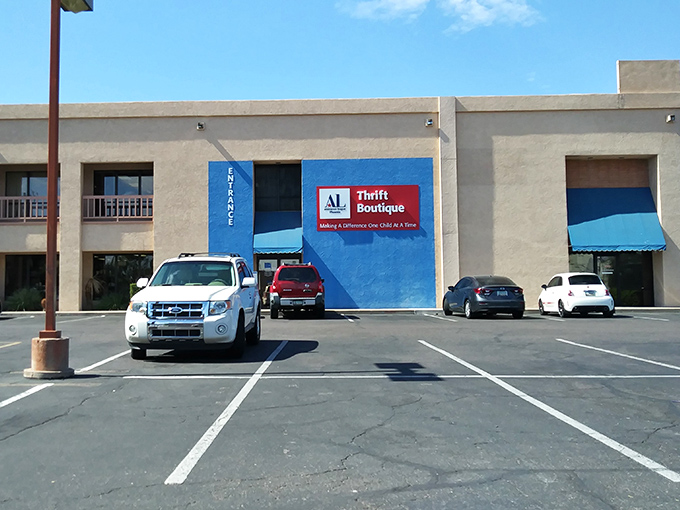 The bright blue exterior stands out like a sapphire in the desert, promising air-conditioned treasure hunting within. No mirage here, folks!