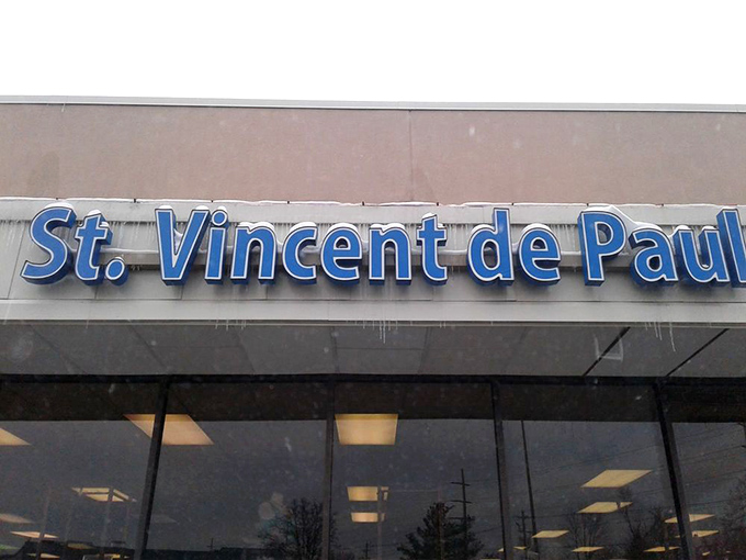 The iconic red Savers sign glows against the twilight sky, beckoning bargain hunters like a retail lighthouse for the thrift-obsessed. 
