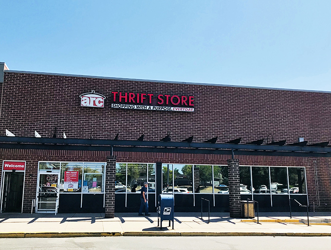 The unassuming brick exterior of arc Thrift Store hides a treasure trove within, like finding a speakeasy but for vintage bargains instead of cocktails.