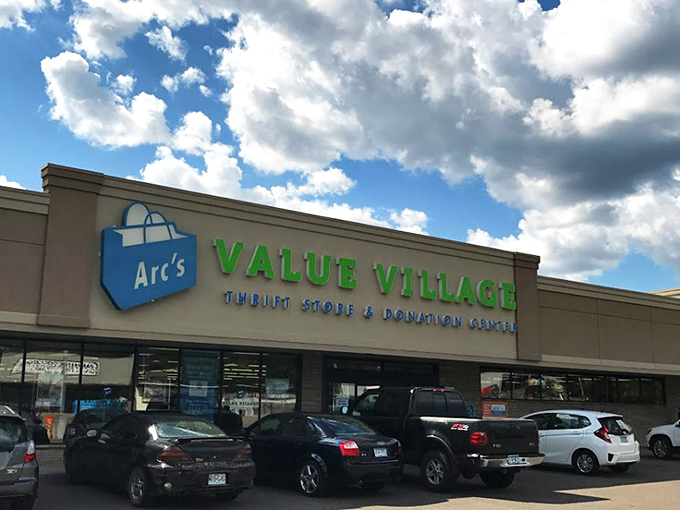 The beige facade with bright blue and green signage isn't just a storefront—it's the gateway to Minnesota's most ambitious treasure hunt.