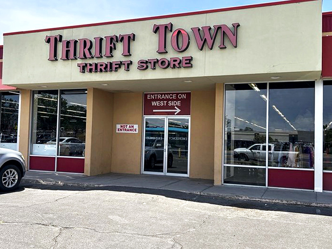 The iconic Thrift Town storefront beckons treasure hunters with its bold red signage, promising adventures that last longer than most Netflix binges.