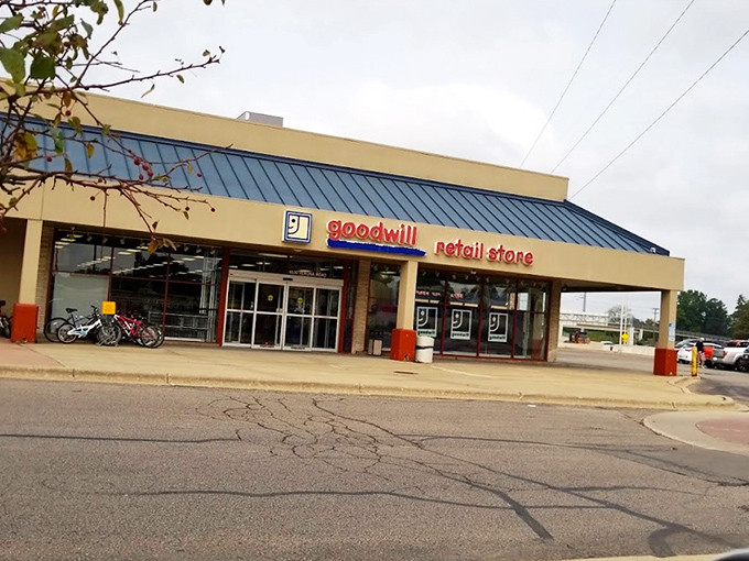 The blue-roofed treasure chest of Madison awaits! Goodwill Nakoma stands like a retail fortress where bargain hunters begin their day-long quests.