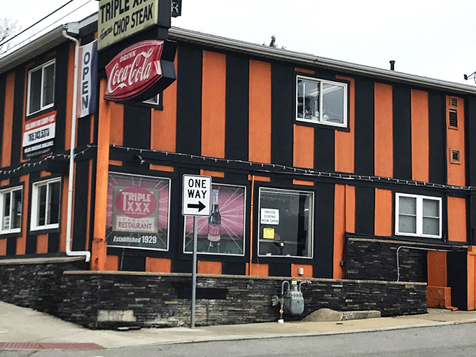 The unmistakable orange and black striped exterior of Triple XXX stands out like a Halloween party that never ended&mdash;in the best possible way.