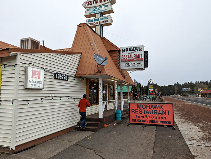 The copper-topped A-frame roof of Mohawk Restaurant stands like a rustic beacon for hungry travelers on Highway 97, complete with patriotic flair. 