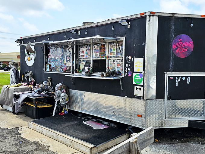 This isn't your average food truck &ndash; it's a haunted mansion on wheels, beckoning hungry souls with its matte black exterior and pink neon logo.