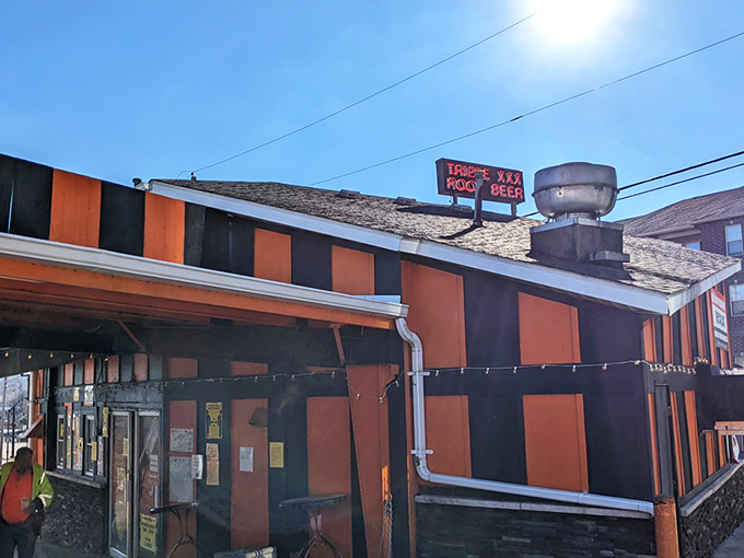 The unmistakable orange and black striped exterior of Triple XXX stands out like a Halloween party that never ended&mdash;in the best possible way.