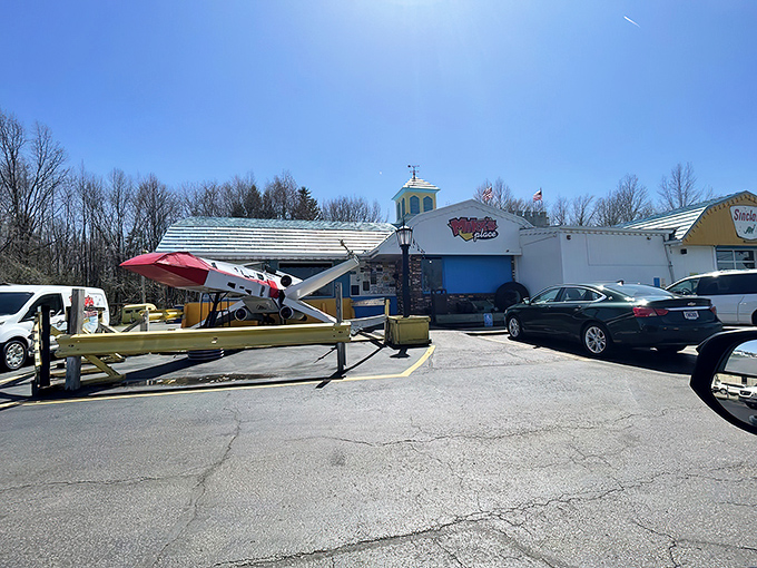 The exterior of Mike's Place looks like what would happen if a diner, a gas station, and an airplane hangar decided to start a family. Complete with its own X-wing fighter!