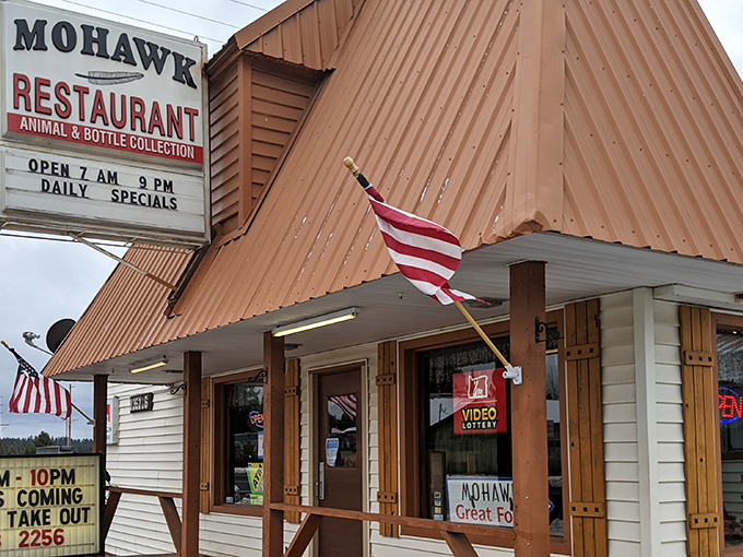 The copper-topped A-frame roof of Mohawk Restaurant stands like a rustic beacon for hungry travelers on Highway 97, complete with patriotic flair.