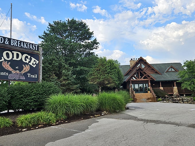 The grand timber entrance beckons with rustic elegance, promising cozy comforts behind those striking teal doors &ndash; a woodland sanctuary minutes from city bustle. 