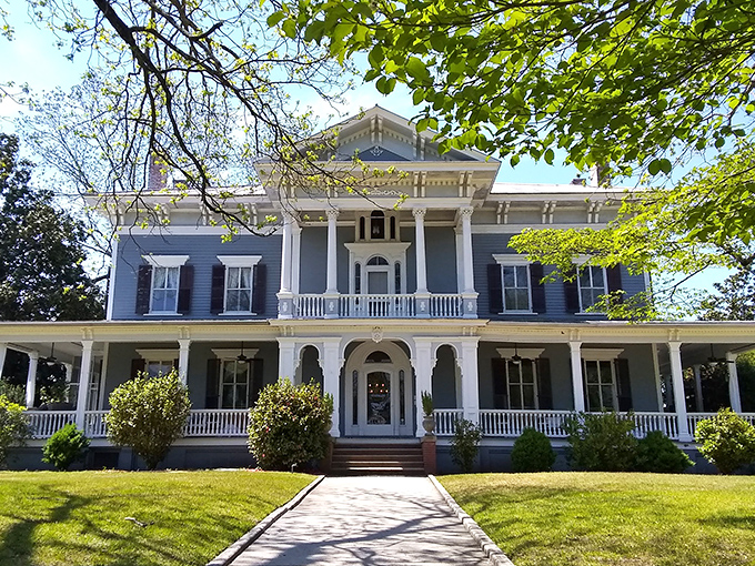 The stately blue Victorian fa&ccedil;ade of Elmwood 1820 stands proudly with its white columns and wrap-around porch, beckoning visitors to slow down and stay awhile.