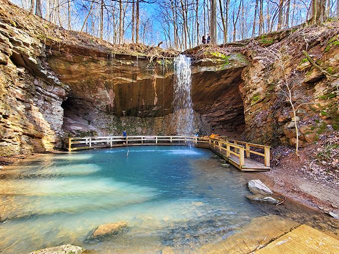 Nature's own infinity pool! The abandoned marble mine at Sloppy Floyd creates a stunning turquoise pool framed by towering rock walls and a delicate waterfall.