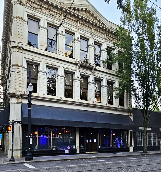 The golden raven beckons from the window, while a creepy doll lurks in the corner. Edgar Allan Poe would approve of this haunting entrance. 