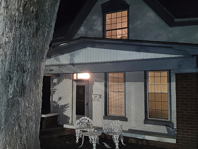 The unassuming facade of the Sallie House belies its reputation as one of America's most haunted locations. Those white walls have stories to tell.