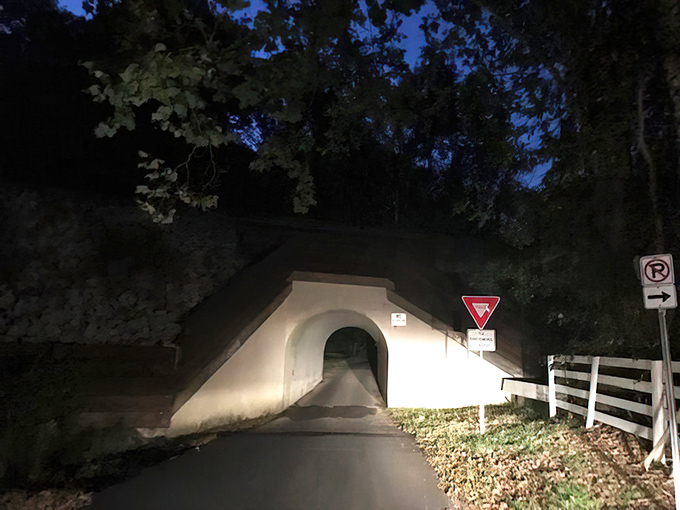Innocence by day, mystery by night. The unassuming entrance to Bunny Man Bridge looks like something from a storybook&mdash;until the sun sets.