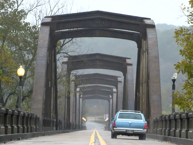 Fog embraces the bridge's grand arches like a Stephen King novel come to life. Perfect backdrop for those "I survived the creepy bridge" selfies.