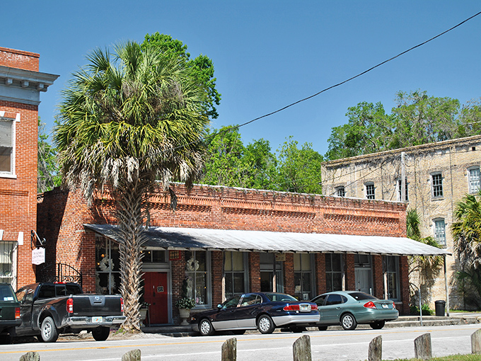 Cholokka Boulevard's historic brick buildings stand as time capsules, where Spanish moss-draped palms and vintage storefronts create Florida's most charming main street.
