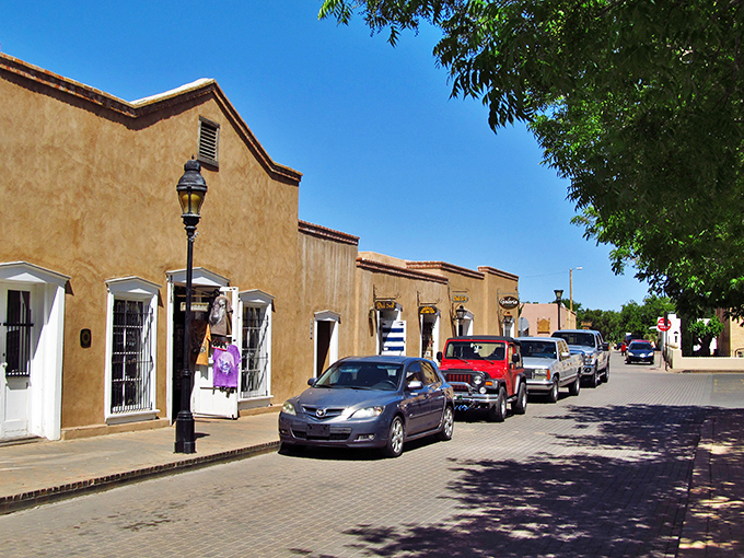 The Organ Mountains create a dramatic backdrop for Mesilla's adobe buildings, like nature's own theatrical curtain for this historic stage.