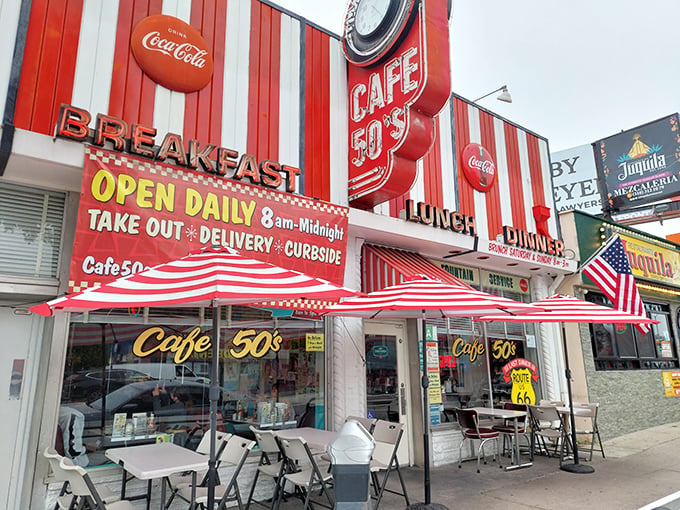 The neon glow of Cafe 50's beckons like a time machine disguised as a diner. Route 66 nostalgia never tasted so good.