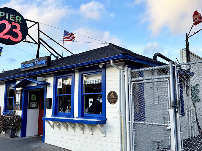 The iconic "23" sign beckons like a lighthouse for hungry souls navigating San Francisco's Embarcadero. Blue trim, waterfront charm, and promises of seafood paradise await.