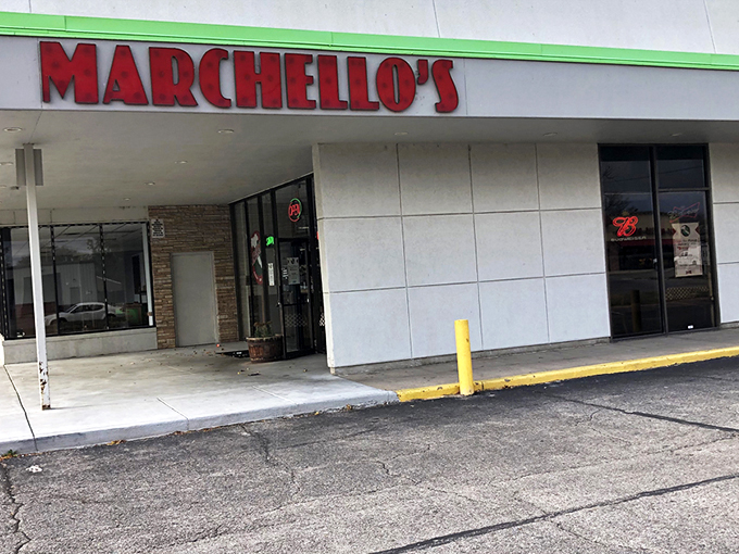 The bright red Marchello's sign stands out like a culinary lighthouse, beckoning hungry travelers to this unassuming strip mall treasure in Wichita.