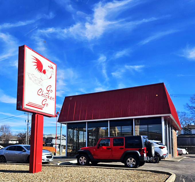 That iconic red building isn't trying to blend in. Go Chicken Go announces itself with all the subtlety of a rooster at dawn, and that's exactly why we love it.