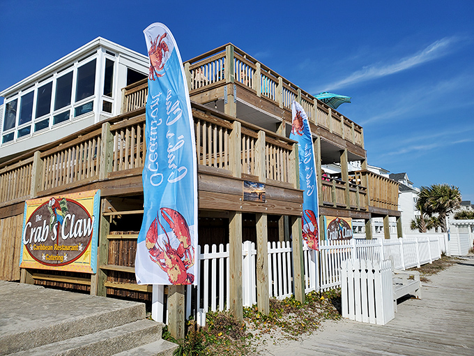 The entrance to paradise isn't pearly gates, but red stairs flanked by tiki totems and colorful flags announcing your arrival at seafood heaven.