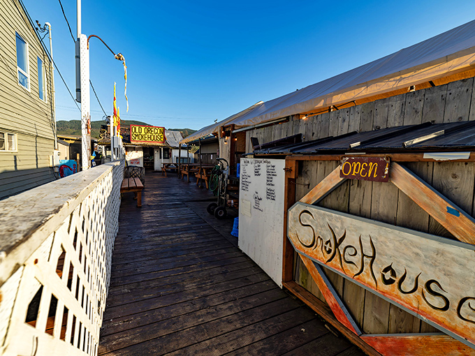 The yellow door beckons like a coastal lighthouse. This weathered shack with its bold sign promises seafood treasures that fancy restaurants can only dream about.