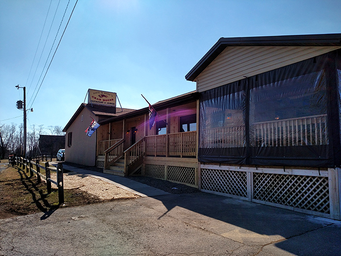 The unassuming exterior of Dave & Jane's Crabhouse beckons like a seafood siren, promising treasures within its wooden walls and wraparound porch.