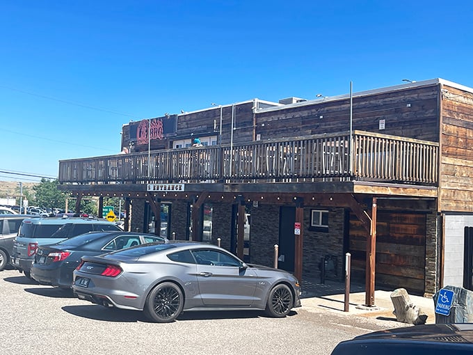The rustic wooden exterior of Seasoned Swine BBQ beckons like a siren song to meat lovers. That deck practically begs you to enjoy your brisket with a side of Colorado sunshine.