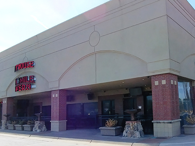 The unassuming exterior of Six Mile Chop House belies the carnivorous paradise within. Red neon beckons hungry Kansans like a lighthouse for the beef-obsessed.