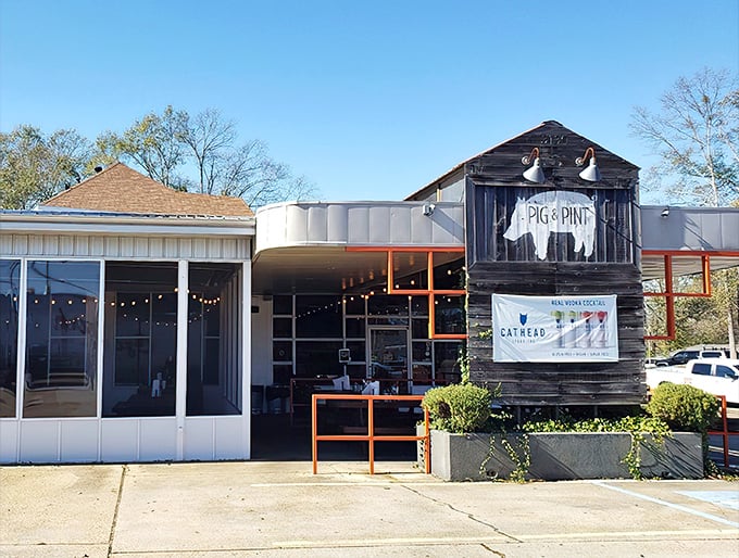 The iconic pig silhouette welcomes barbecue pilgrims to this Fondren district gem, where string lights promise good times ahead.