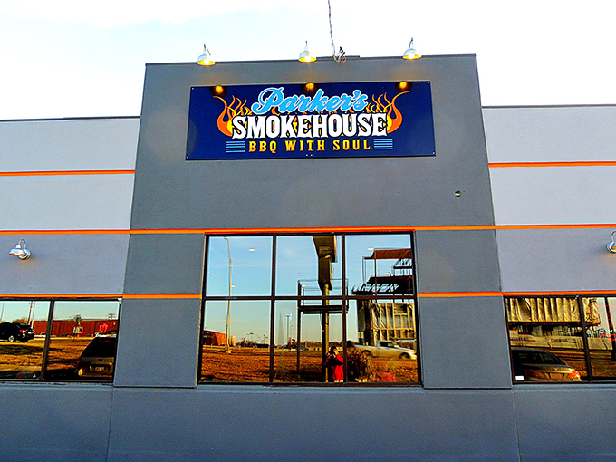The blue neon sign proclaiming "BBQ WITH SOUL" isn't just marketing&mdash;it's a mission statement that Parker's Smokehouse delivers on with every smoky bite.