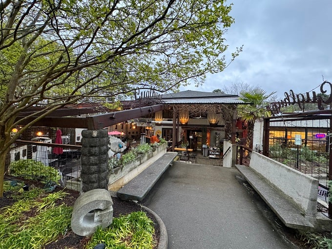 A slice of Bavaria in Durham! This charming outdoor patio is where lederhosen meets Southern hospitality, complete with red umbrellas that pop like cherry tomatoes in a garden salad.