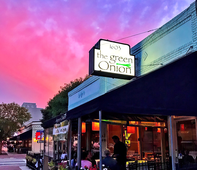 The Green Onion's charming exterior welcomes you with its understated elegance and inviting patio. Like a good first date, it makes a promising impression without trying too hard.