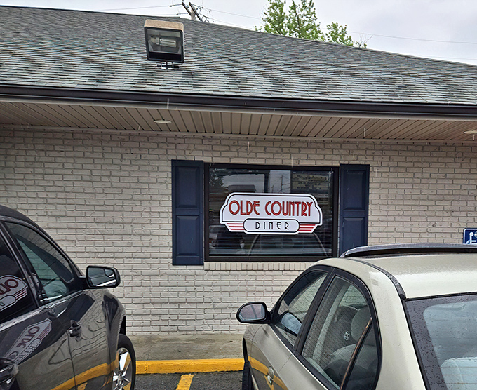 The unassuming brick exterior of Olde Country Diner &ndash; proof that culinary treasures often hide in the most modest packages.