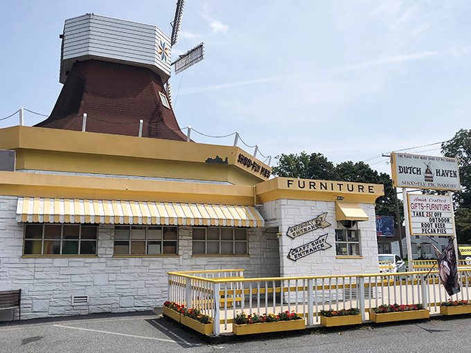 The iconic windmill atop Dutch Haven stands like a lighthouse for dessert lovers, guiding hungry travelers to pie paradise on Route 30.