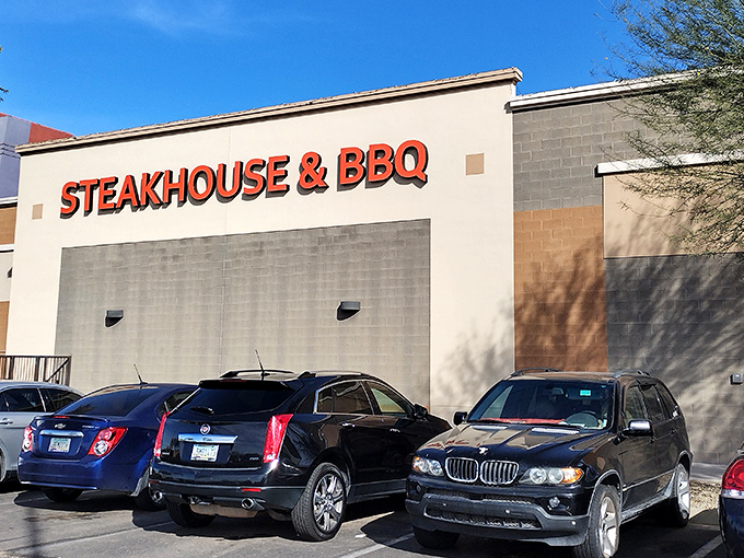 The unassuming exterior of Hideout Steakhouse & BBQ proves once again that culinary treasures often hide in plain sight. Desert dining at its finest awaits inside.