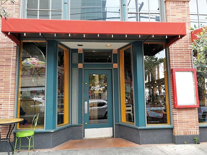 The bright orange awning and cheerful yellow chairs are like a beacon calling to barbecue pilgrims on Oakland's Broadway. Welcome to flavor town.