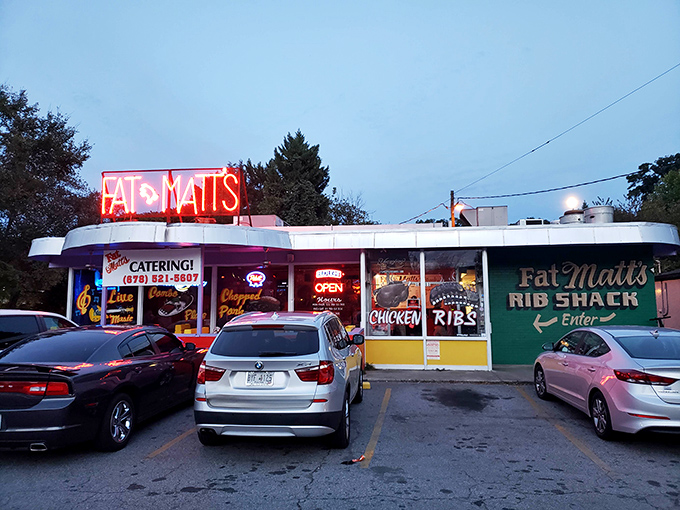 The neon glow of Fat Matt's sign is like a barbecue beacon in the night, calling hungry souls to meat salvation on Piedmont Avenue.