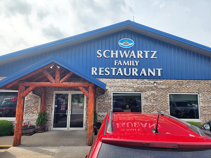 The blue-roofed haven of homestyle cooking stands proudly against an Indiana sky, promising comfort food that'll make your soul sing.