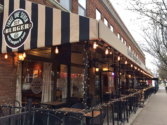The iconic black and gold striped awning of 317 Burger beckons hungry travelers like a lighthouse for the famished. "Craft Burgers & Beer" isn't just a promise&mdash;it's a mission statement.
