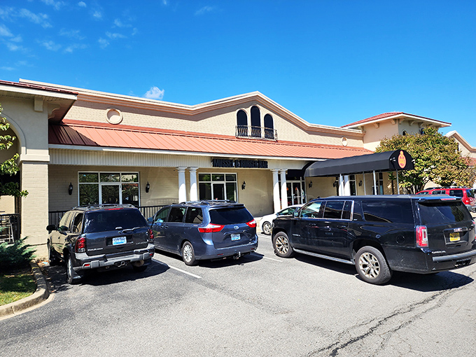 The unassuming exterior of Mussel & Burger Bar belies the culinary treasures within. Like finding a diamond in a strip mall setting.