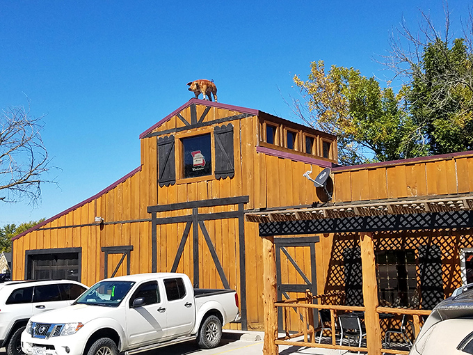 Step into barbecue paradise where that barn-style exterior isn't just rural charm—it's a smoke signal calling hungry travelers from miles around.