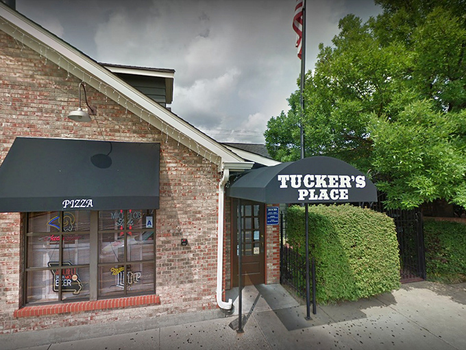 The iconic brick exterior of Tucker's Place glows with welcome in the evening light, a beacon for hungry carnivores throughout Manchester.