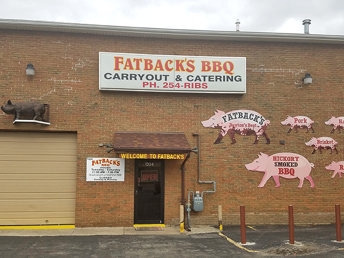 The pink pig silhouettes on Fatback's brick exterior aren't just decoration&mdash;they're a roadmap to flavor paradise. Welcome to pork heaven!
