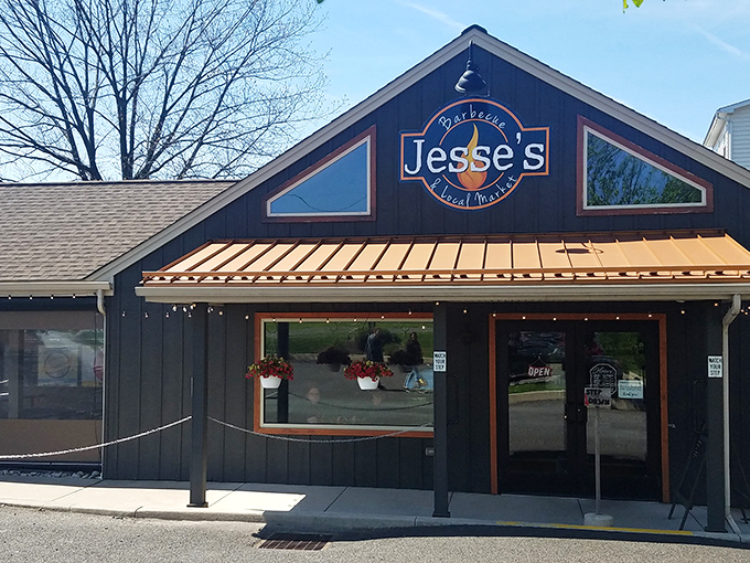 Jesse's welcoming exterior beckons hungry travelers with its rustic charm and copper accents. The promise of barbecue paradise awaits behind those doors.