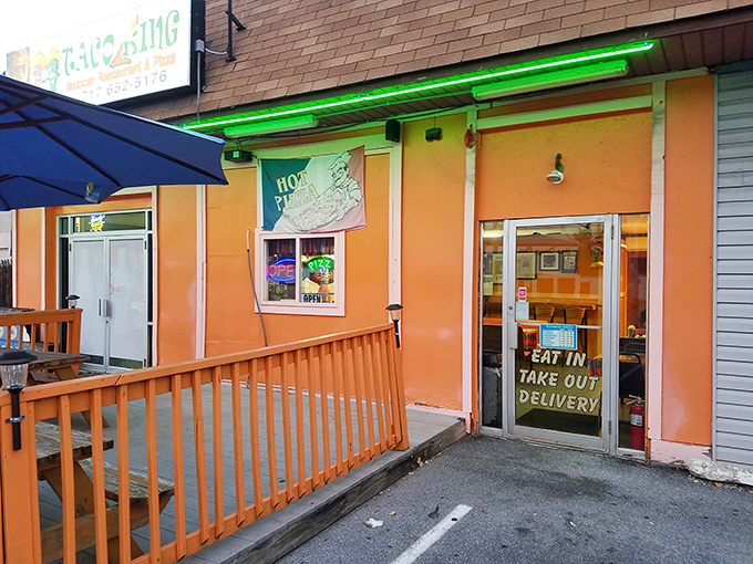 The bright orange exterior of Taco King stands like a beacon of culinary promise on Allentown Boulevard. Your taste buds' happy place awaits!