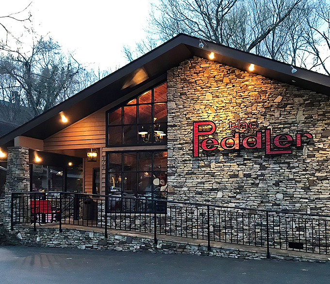 The rustic stone and timber exterior of The Peddler Steakhouse blends perfectly with its Smoky Mountain surroundings, like a carnivore's cabin in the woods.
