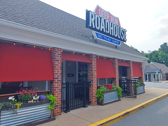 The unassuming exterior of Deep Run Roadhouse proves once again that the best BBQ joints often look like places your GPS would apologize for sending you to.