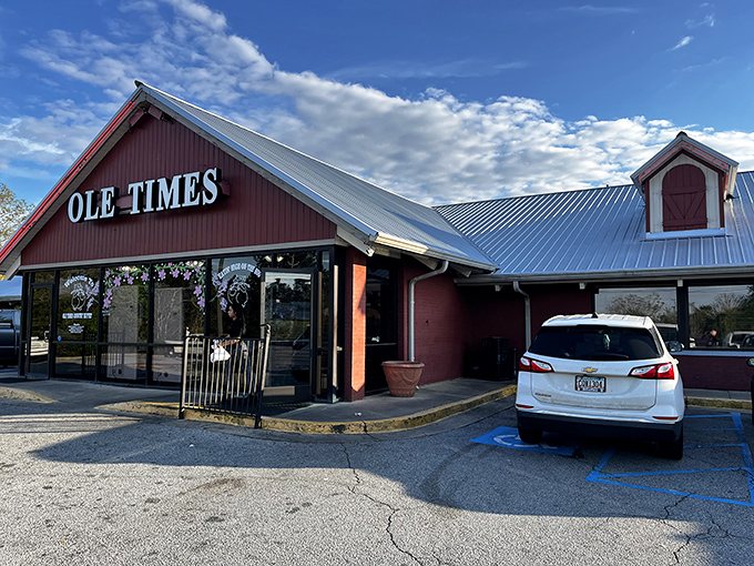 The iconic red barn exterior of Ole Times Country Buffet stands like a beacon of Southern comfort food, promising delicious abundance within those welcoming walls.